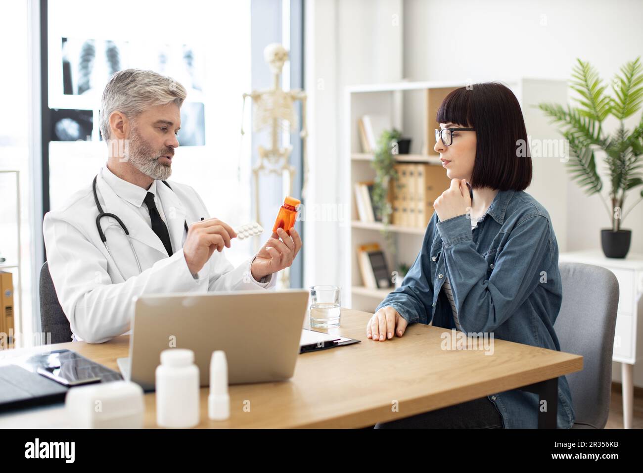 Female therapist prescribing medications hi-res stock photography and ...