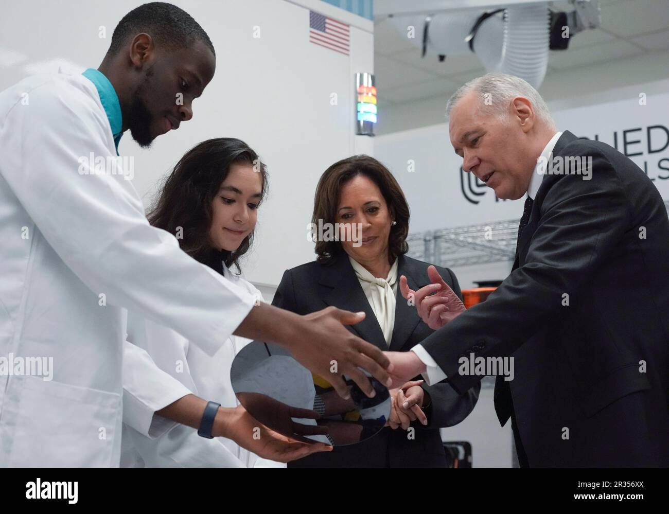 Vice President Kamala Harris, second from right, listens as Applied ...