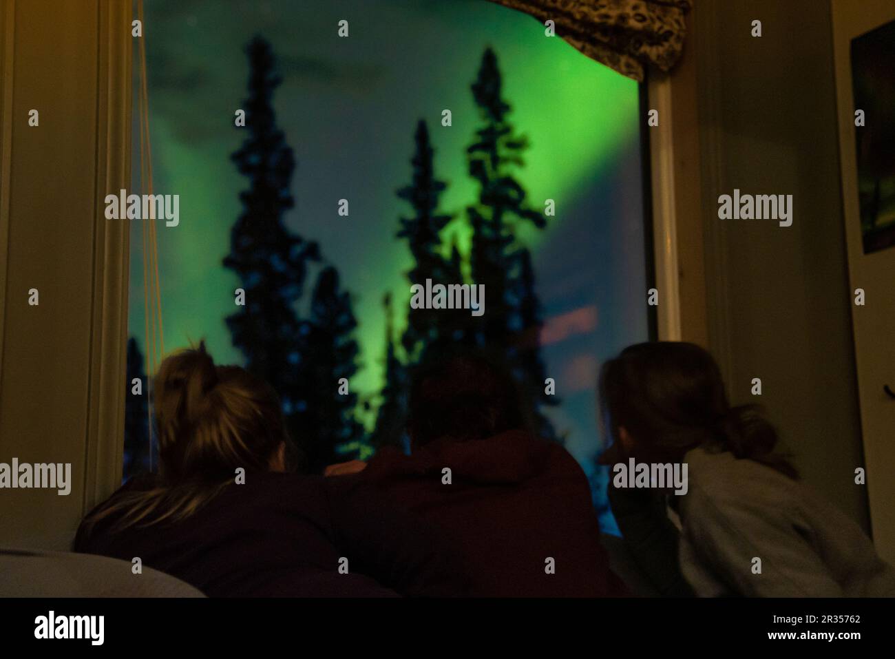 Northern lights display seen in northern Canada, Yukon Territory. Three ...