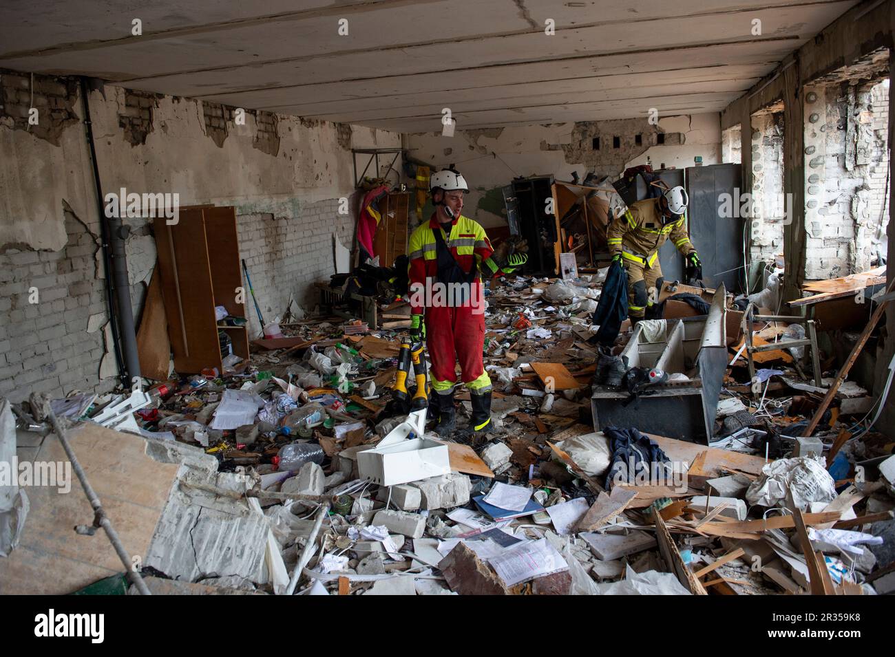 Dnipro, Ukraine. 21st May, 2023. Emergency personnel look for surviving ...