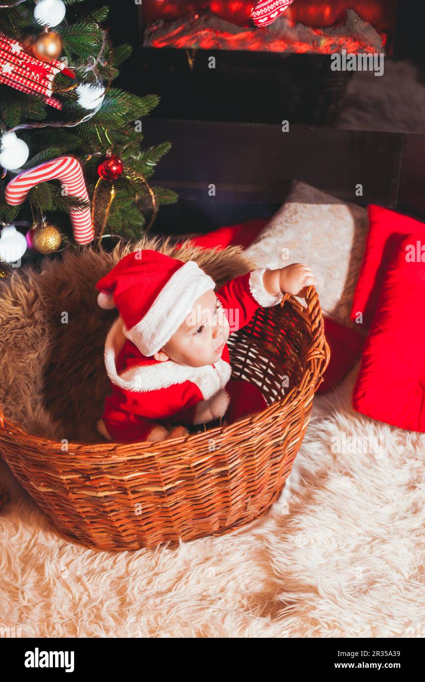 Baby in Santa costume Stock Photo - Alamy