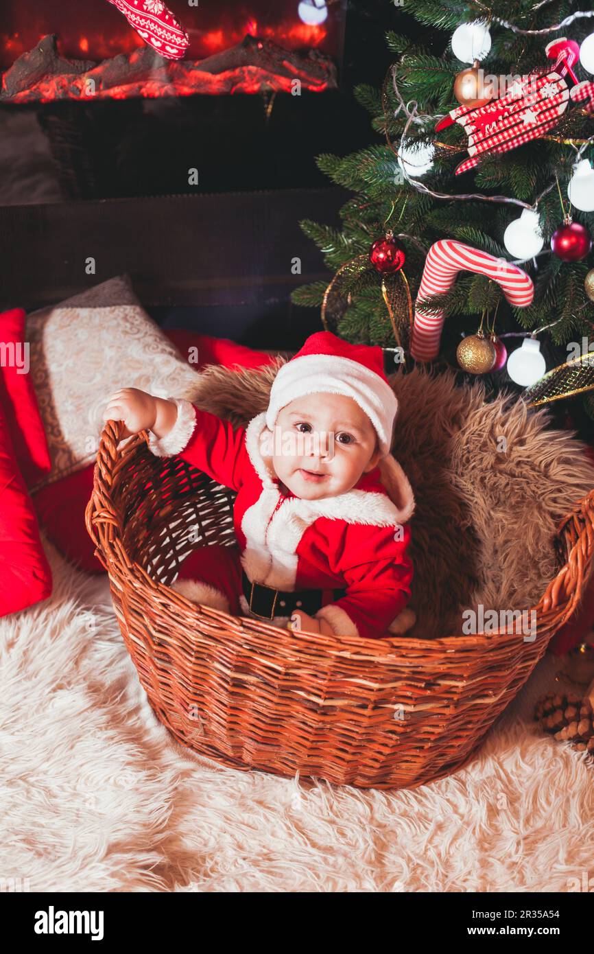 Baby in Santa costume Stock Photo - Alamy