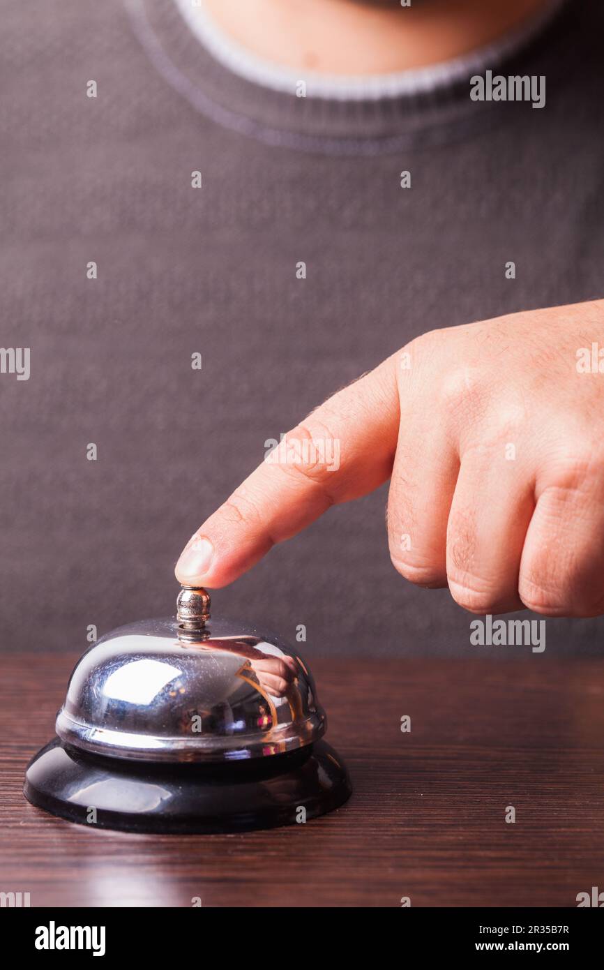 Hotel bell hand hi-res stock photography and images - Alamy