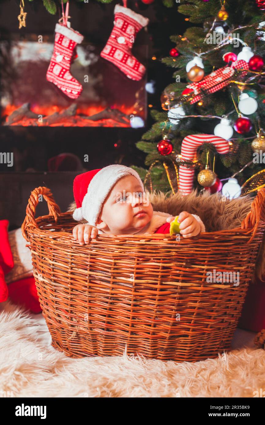 Baby in Santa costume Stock Photo - Alamy