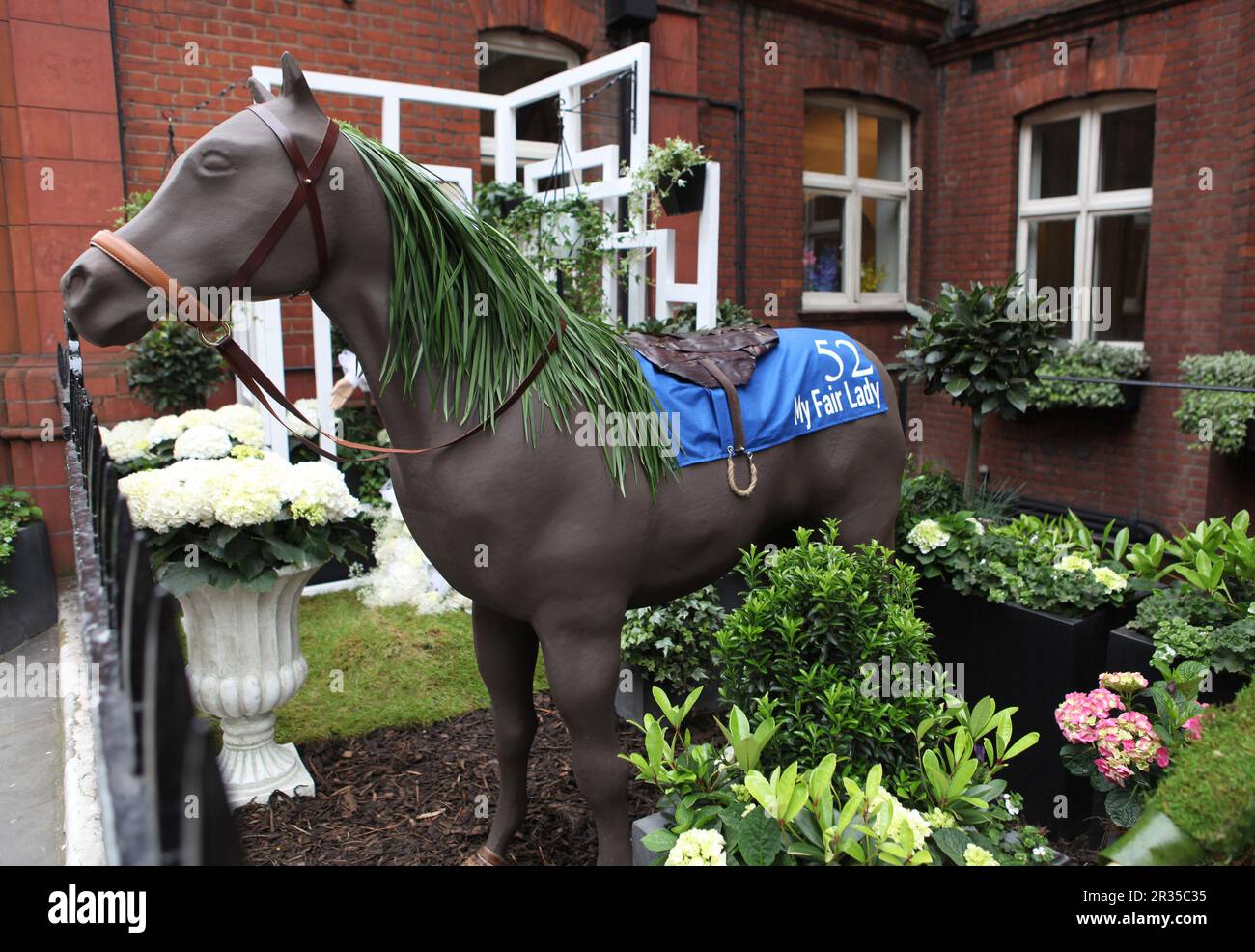 London.UK. A floral display with showroom dummies dressed up as a horse ...