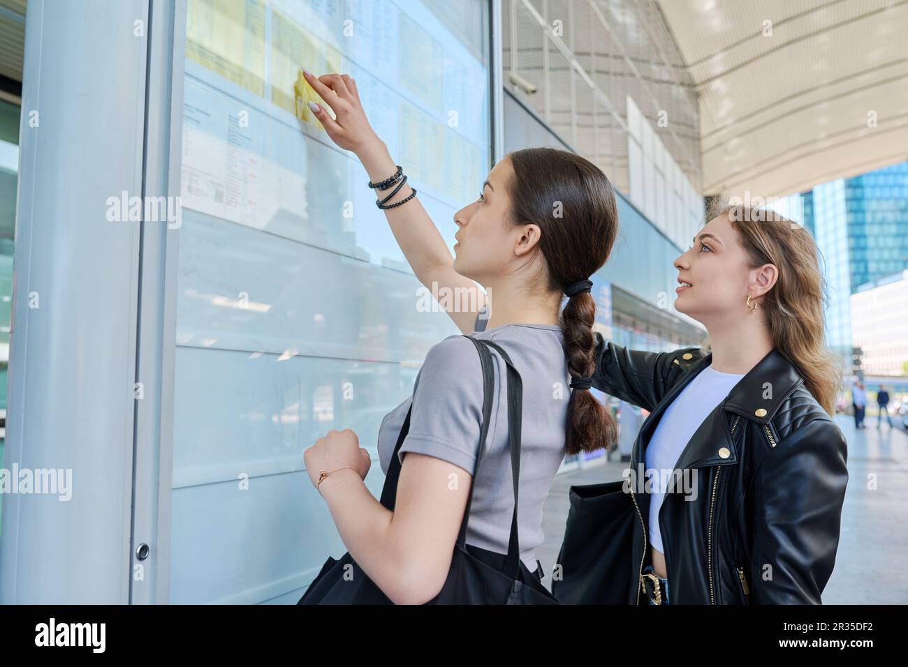 Woman reading bus timetable hi-res stock photography and images - Alamy