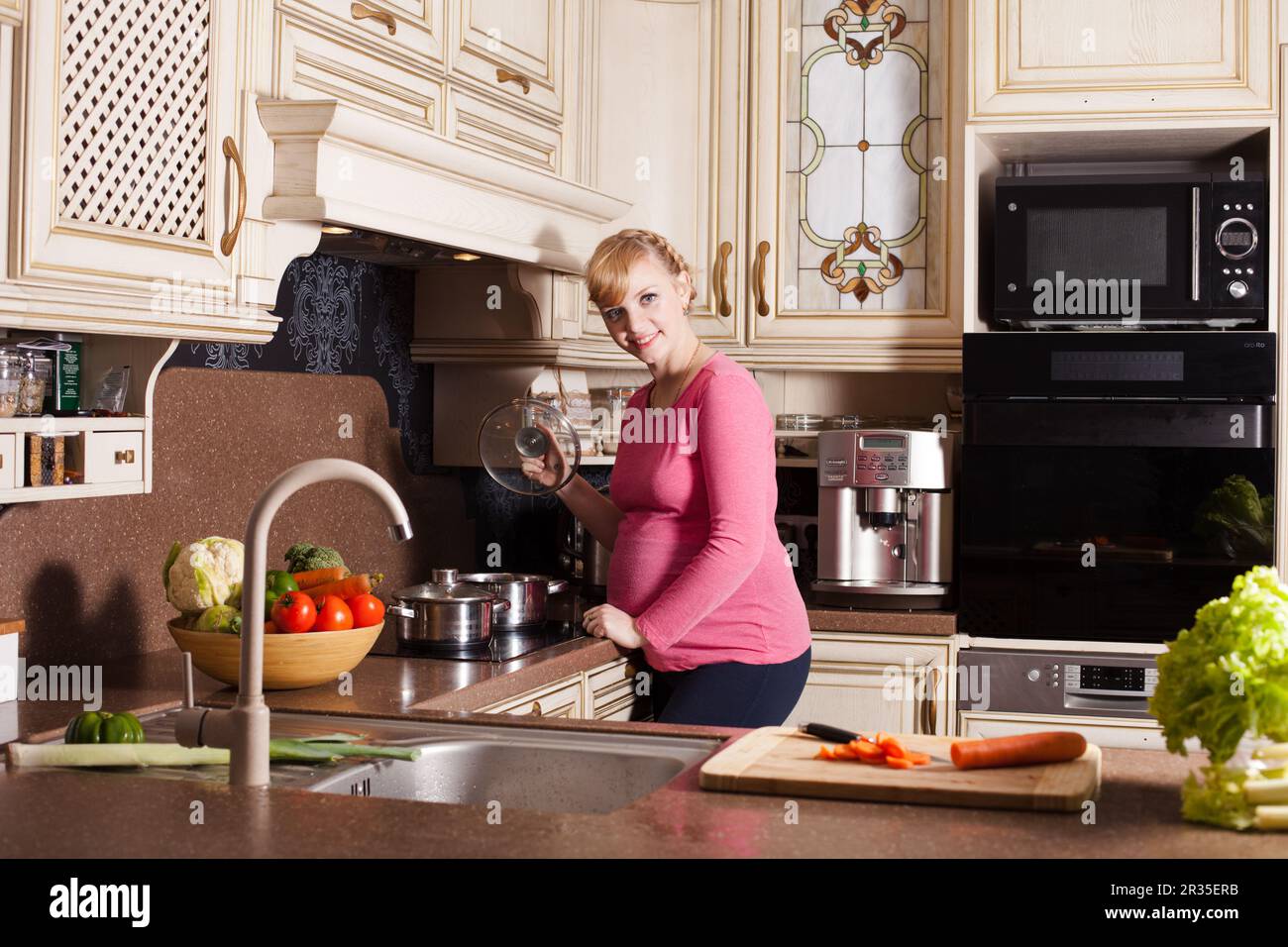 Woman cooking casserole dish hi-res stock photography and images - Alamy