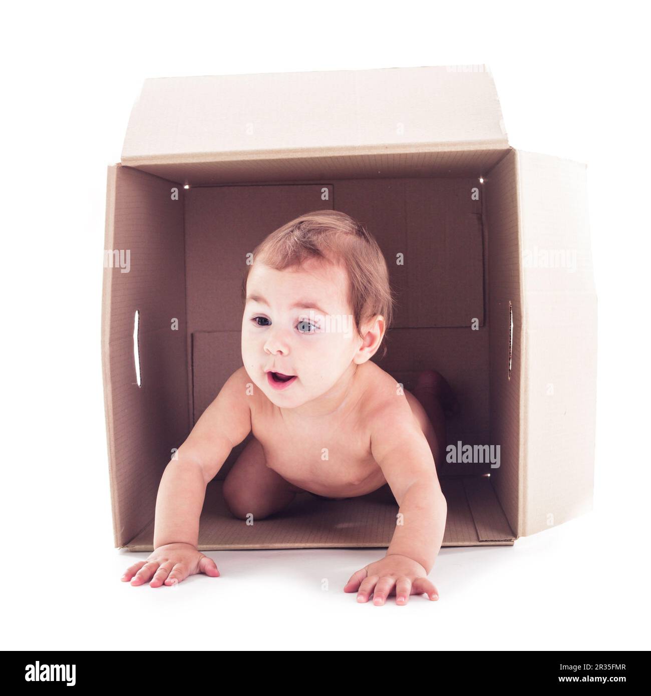 Baby and the box Stock Photo - Alamy