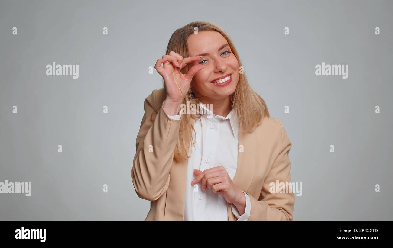 Need some more, please give me. Woman in formal suit showing a little ...