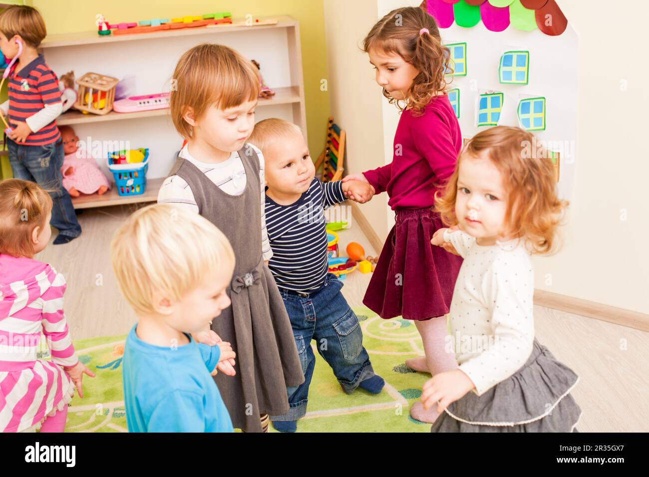 Group of little children dancing Stock Photo - Alamy