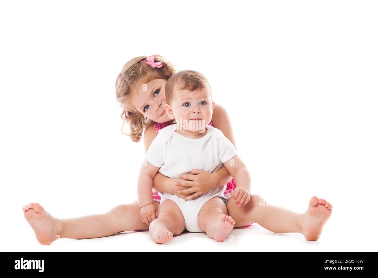 Two sisters isolated Stock Photo - Alamy