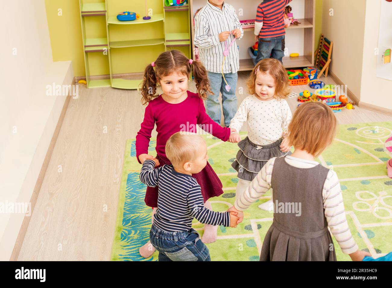 Group of little children dancing Stock Photo - Alamy