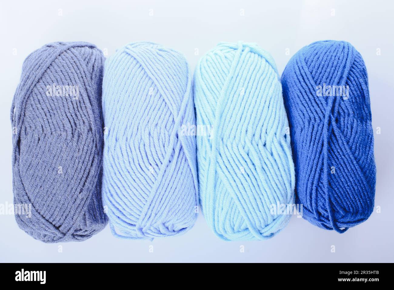 Blue yarn ball Stock Photo - Alamy