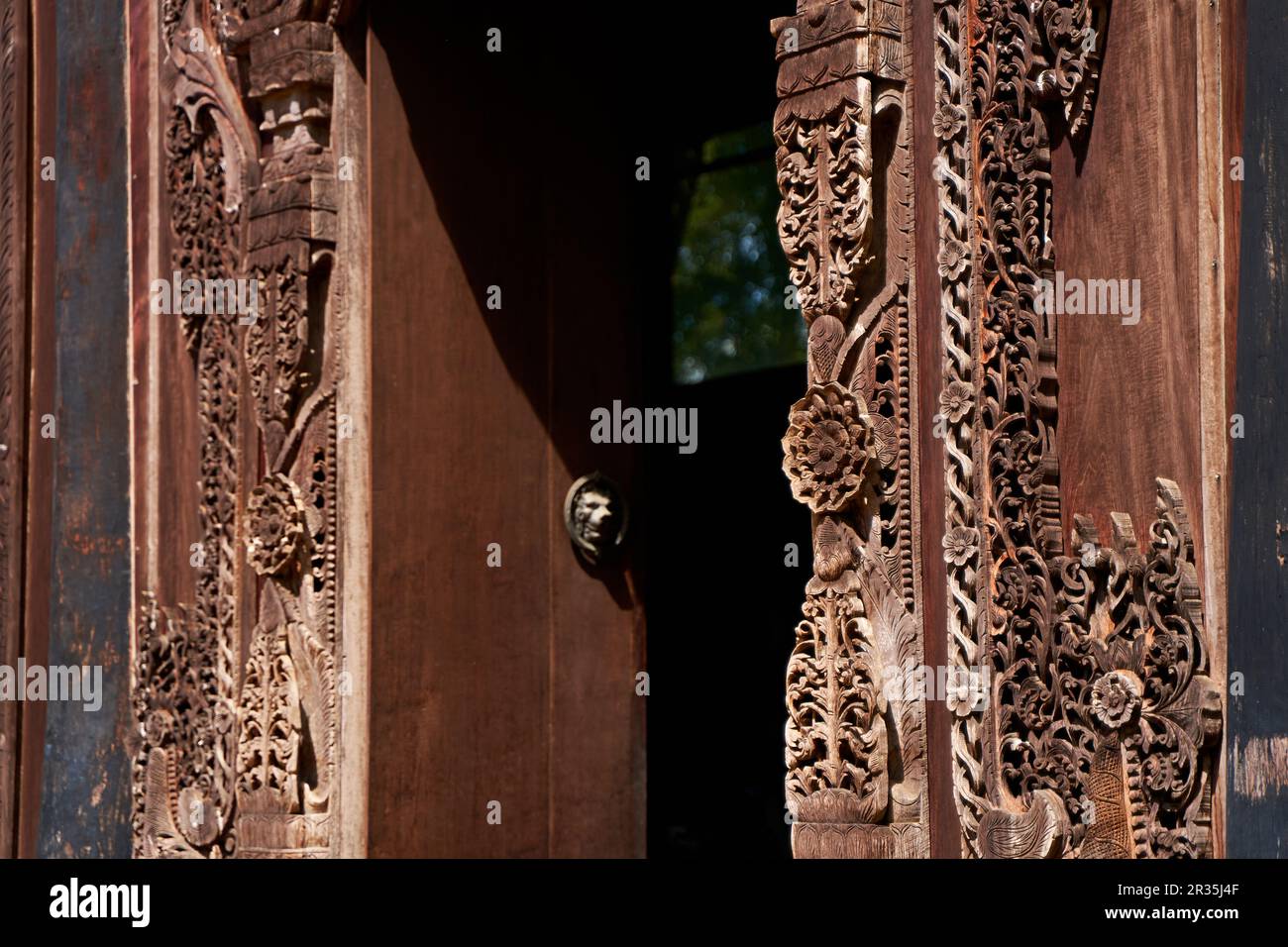 Artistic Woodcarving: Intricate Door Panel Design in a Thai Temple ...