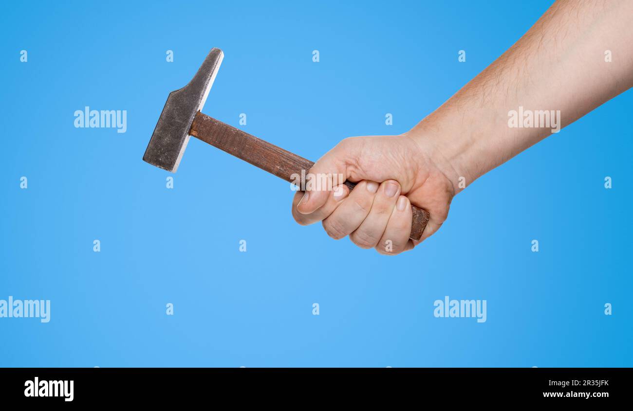 Man holding a hammer in his hand (clipping path Stock Photo - Alamy