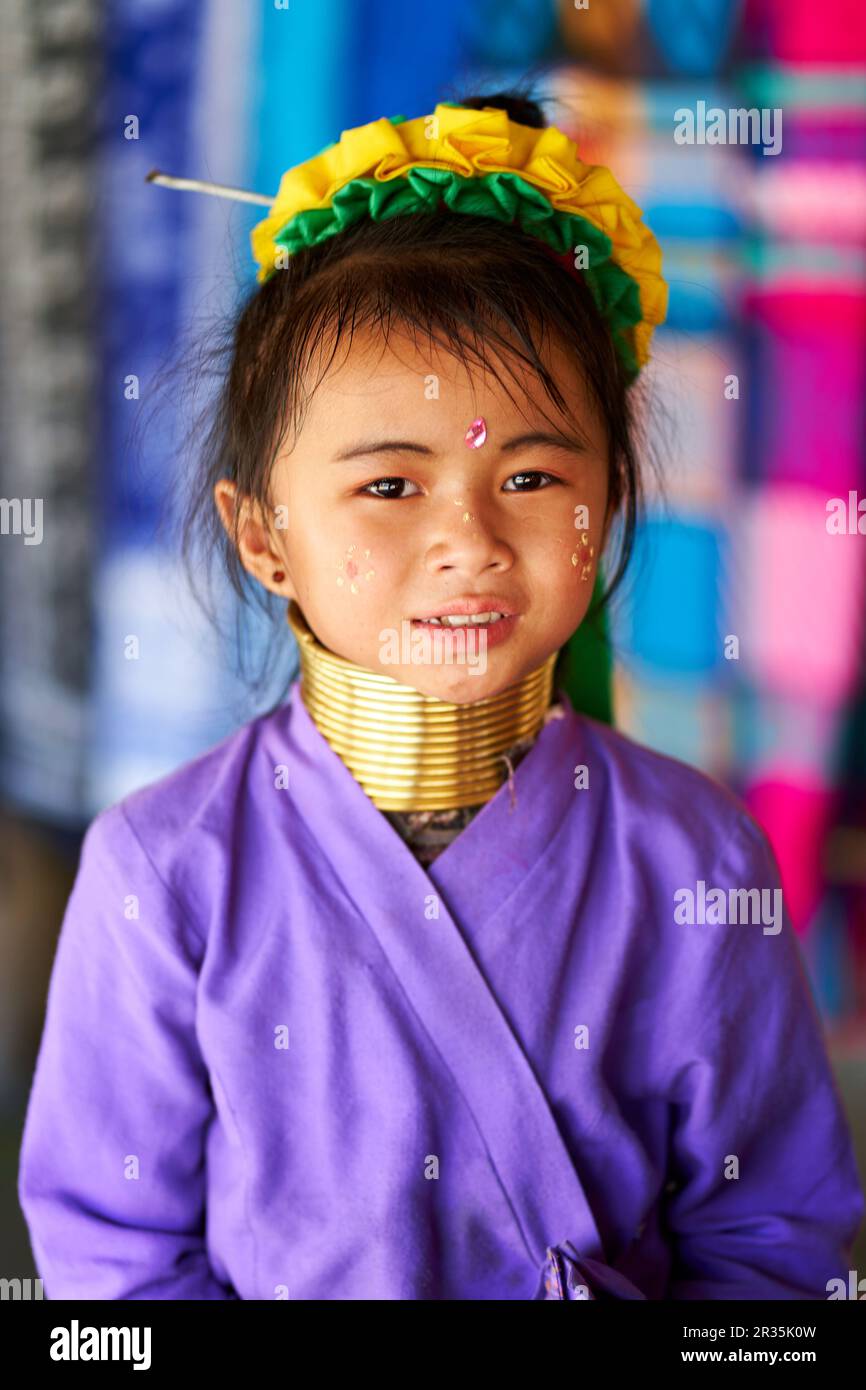 Teenage girl from the Long Neck tribe, wearing traditional brass rings ...