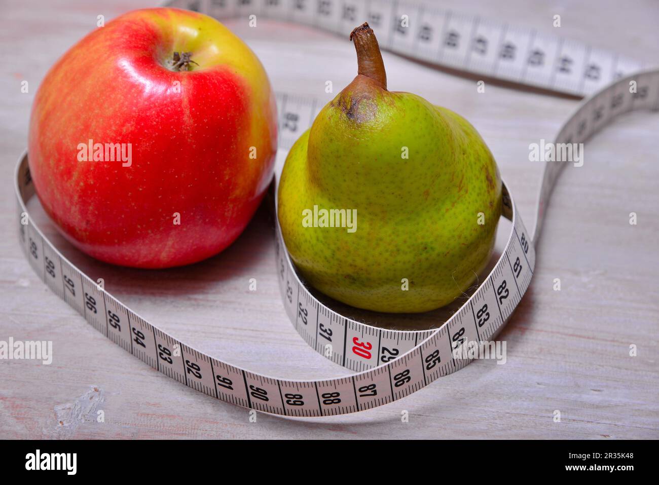 Slimming apple pear tea tape measure Stock Photo - Alamy
