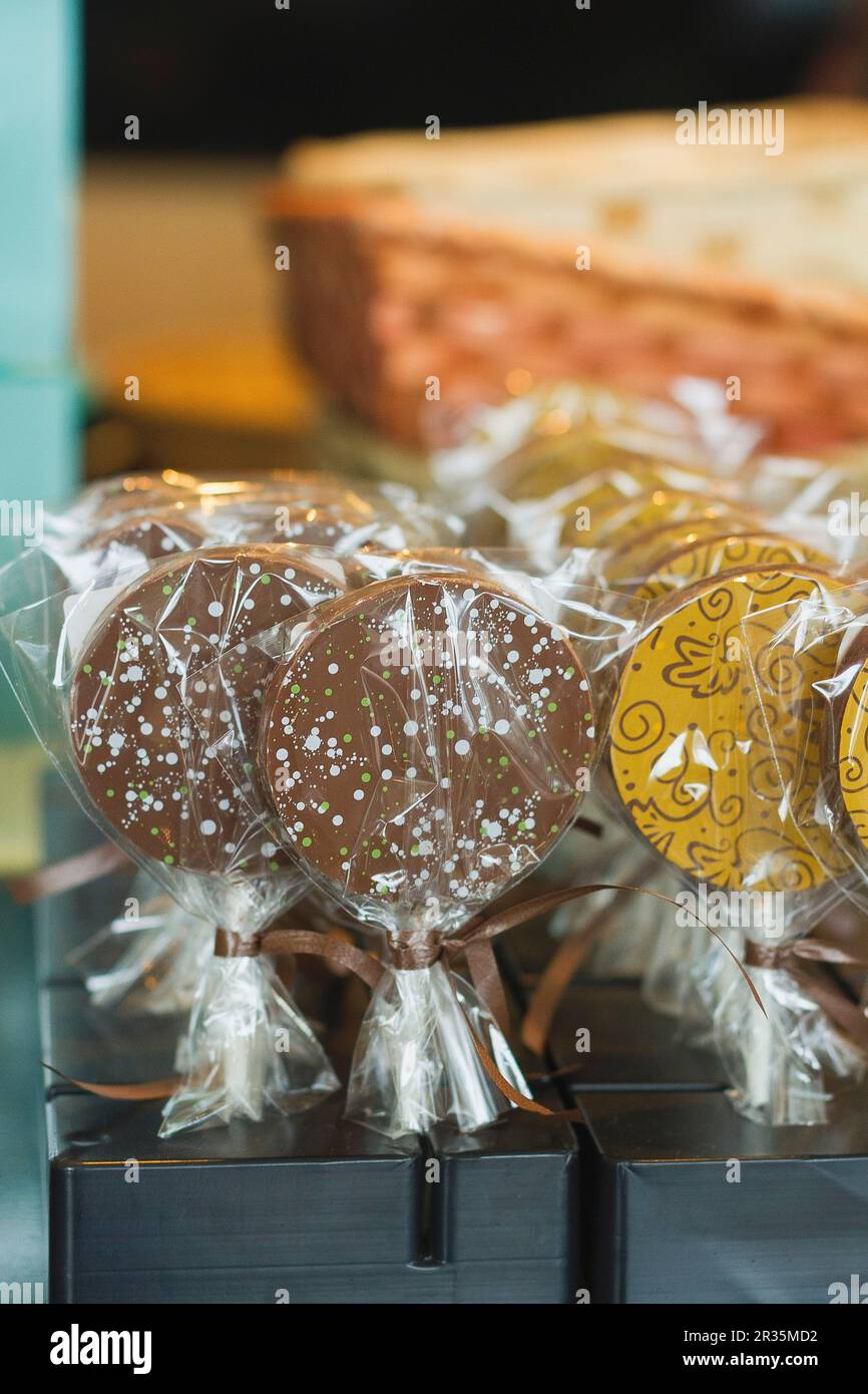 Chocolate lollies wrapped in cellophane Stock Photo - Alamy