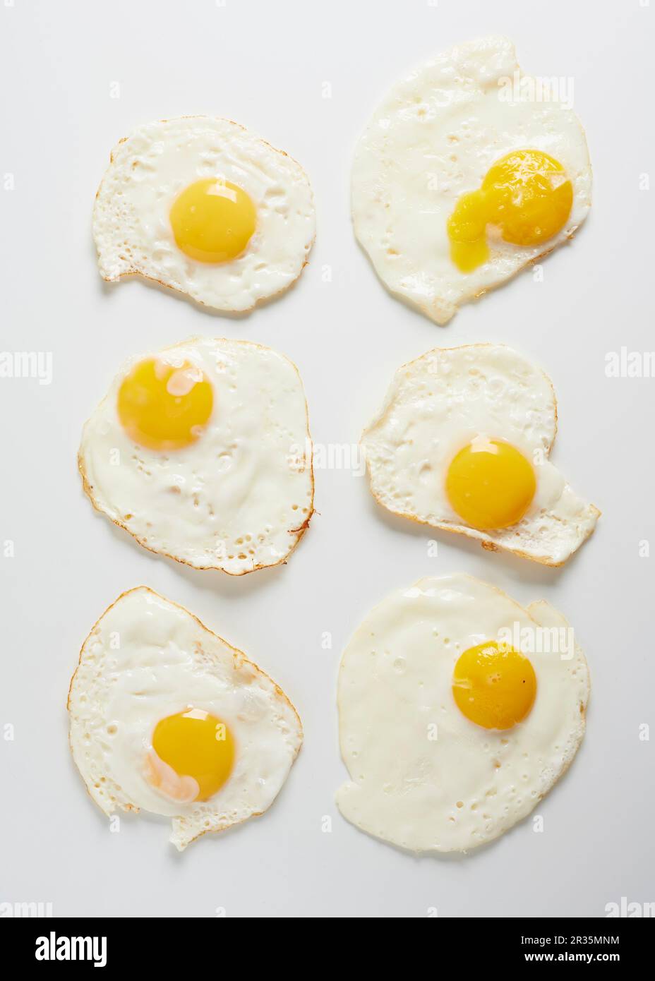Six fried eggs Stock Photo - Alamy