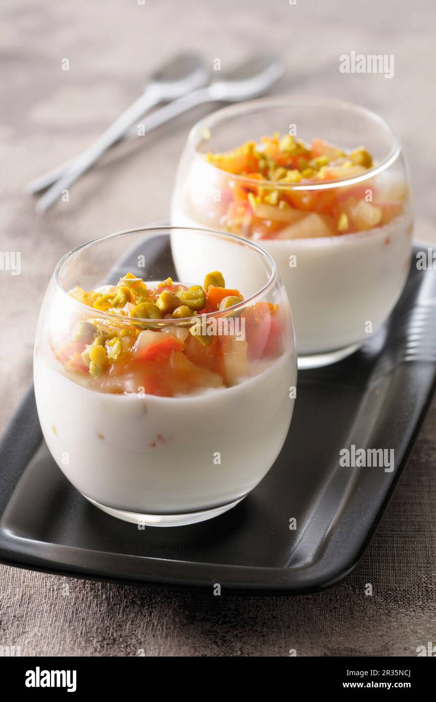 Quark cream with apple and quince compote Stock Photo - Alamy