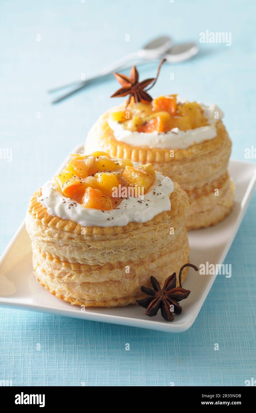 Vol-au-vents filled with spiced compote and orange cream Stock Photo ...