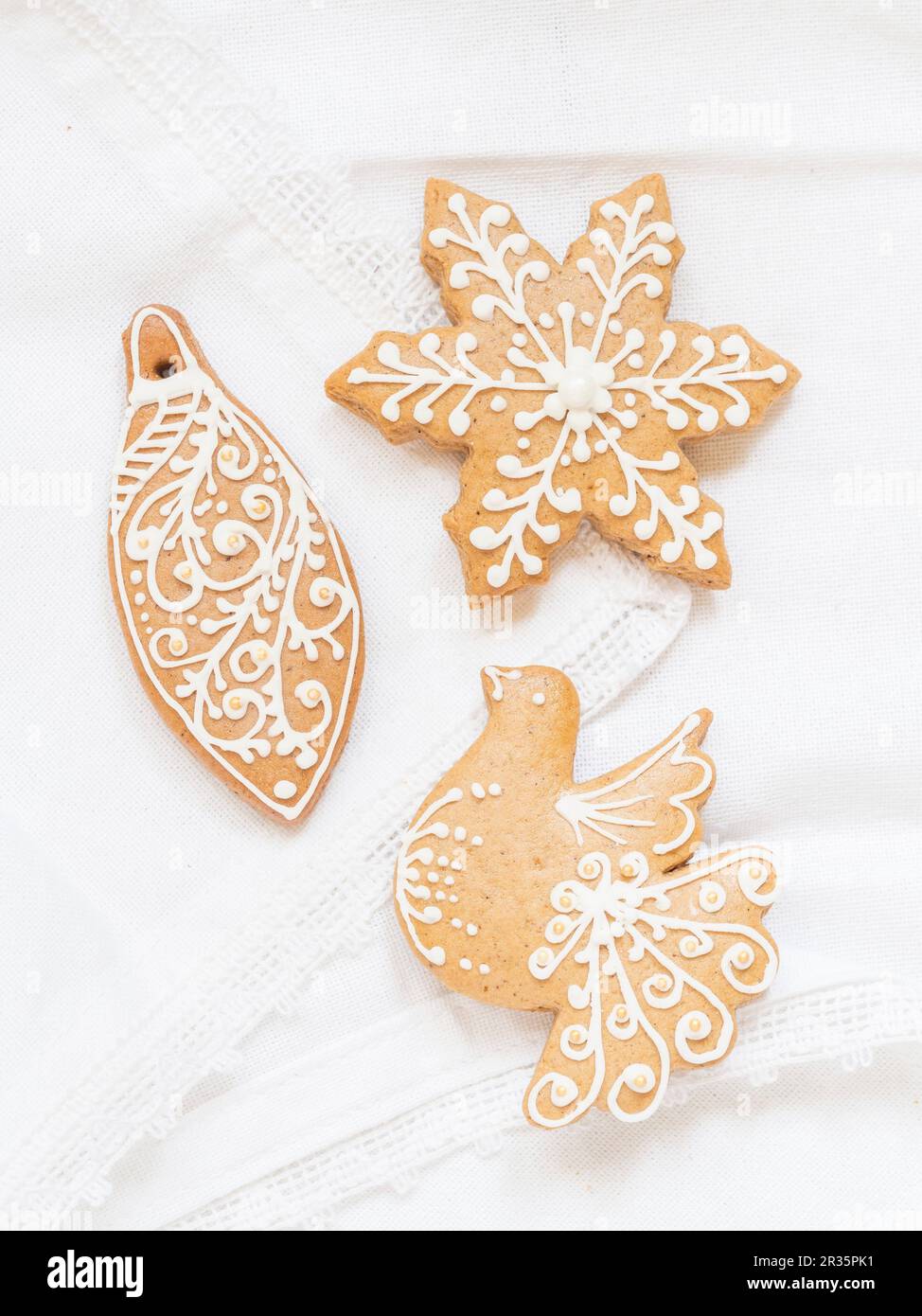 Homemade gingerbread biscuits decorated with white icing Stock Photo ...