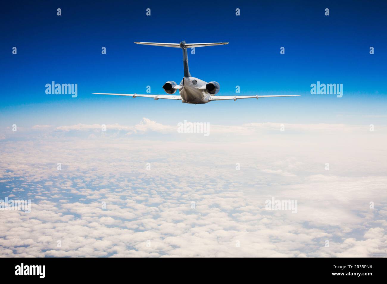 Flying an airplane in the sky Stock Photo - Alamy