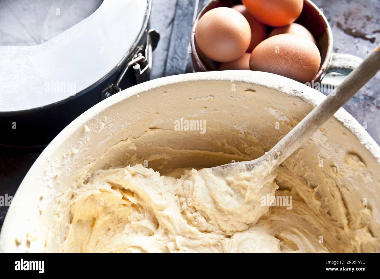 Sponge cake mixture being stirred Stock Photo - Alamy