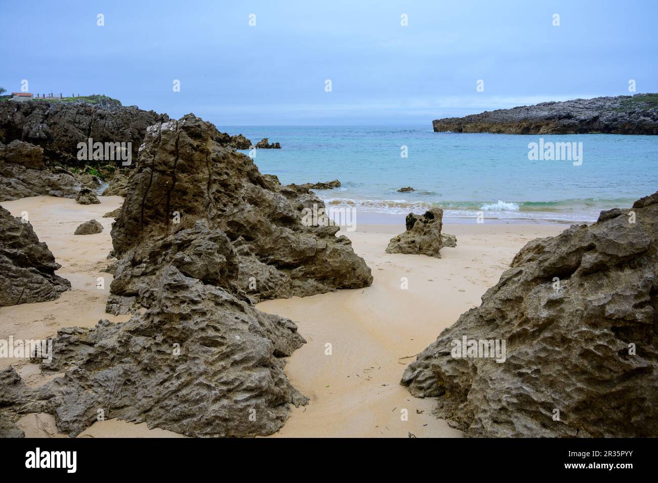View on rocks on Playa de Toro in Llanes, Green coast of Asturias ...