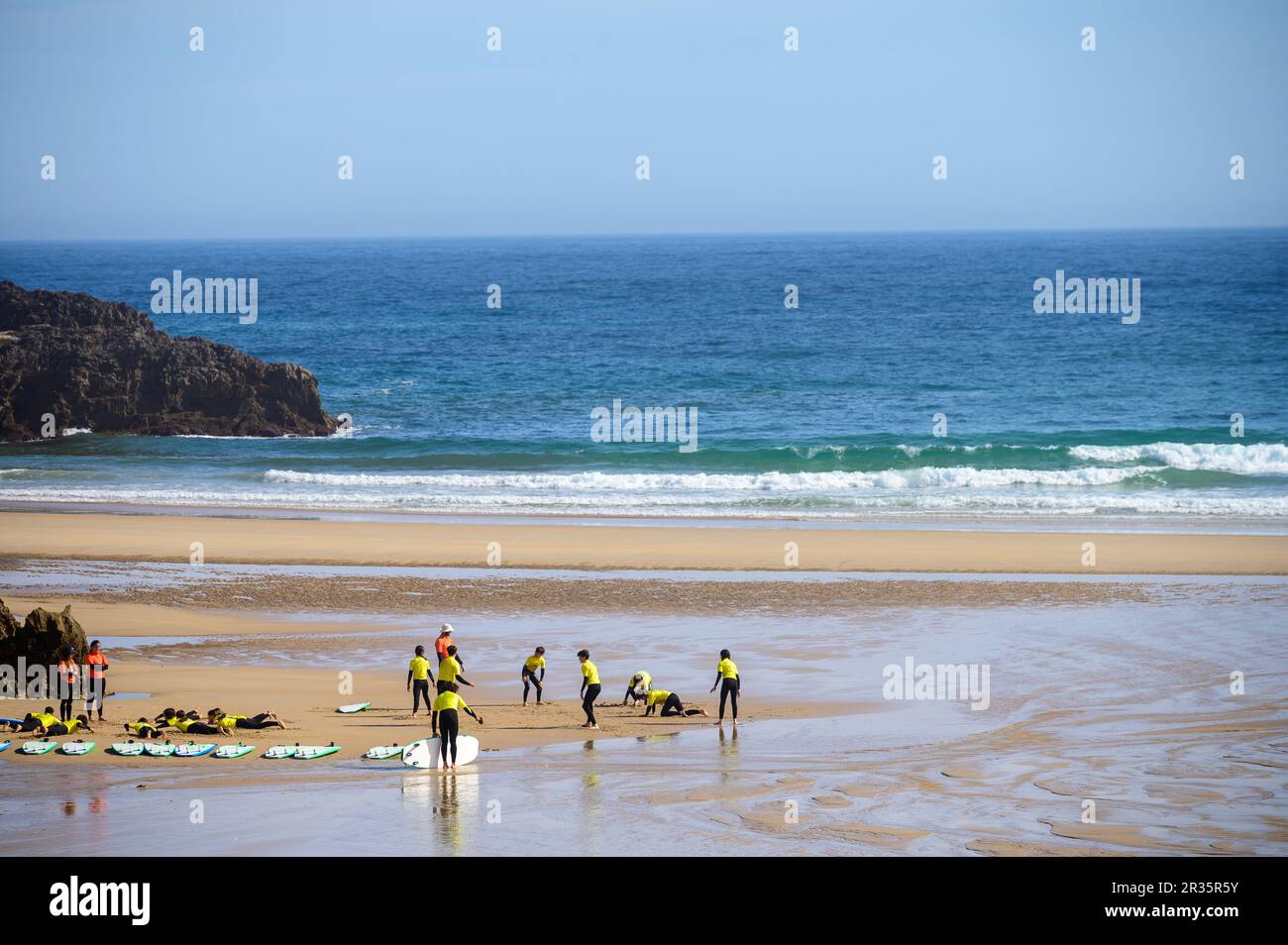 Young surfers train with boards on Playa de Palombina Las Camaras in ...