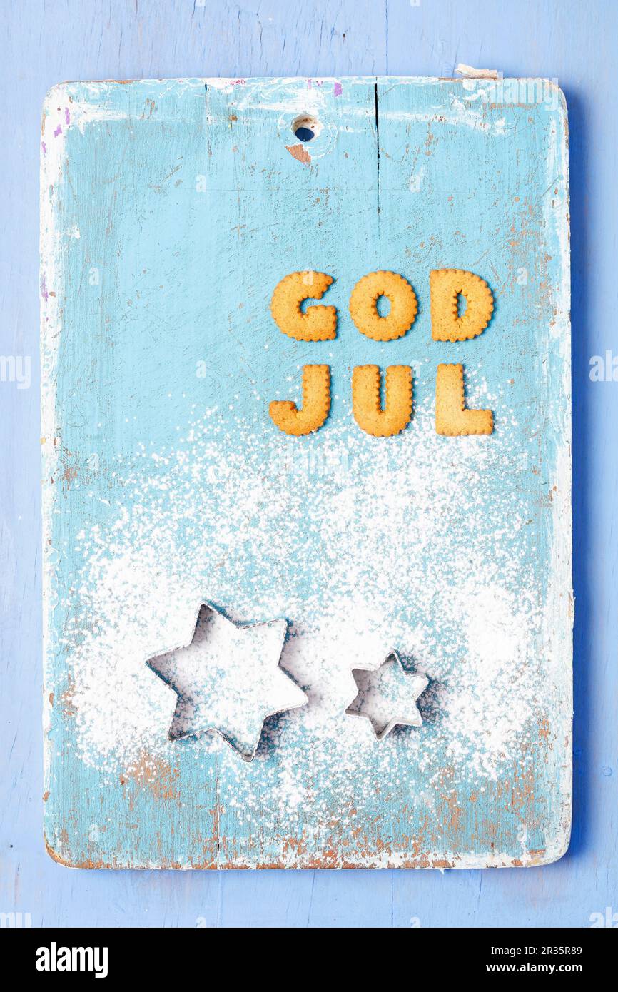 Christmas greetings written with biscuits in Swedish and cutters Stock ...