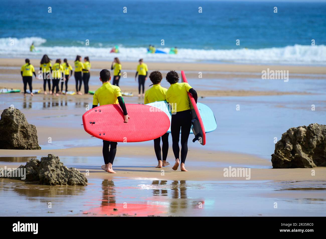 Young surfers train with boards on Playa de Palombina Las Camaras in ...