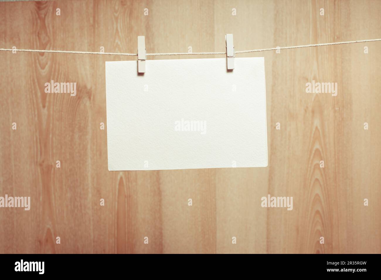 Paper on the clothesline Stock Photo - Alamy