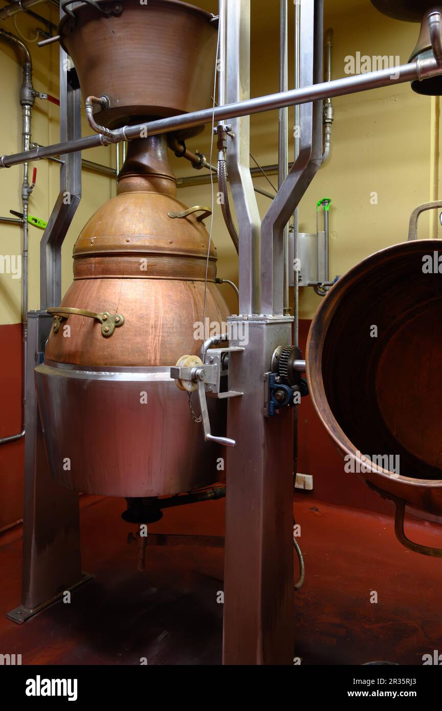 Gin alcoholic drink distillation process in copper tanks in Spanish ...