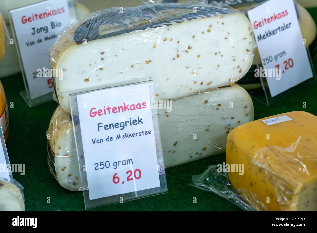 Tasting of different cheeses in Dutch cheese farm shop, English ...