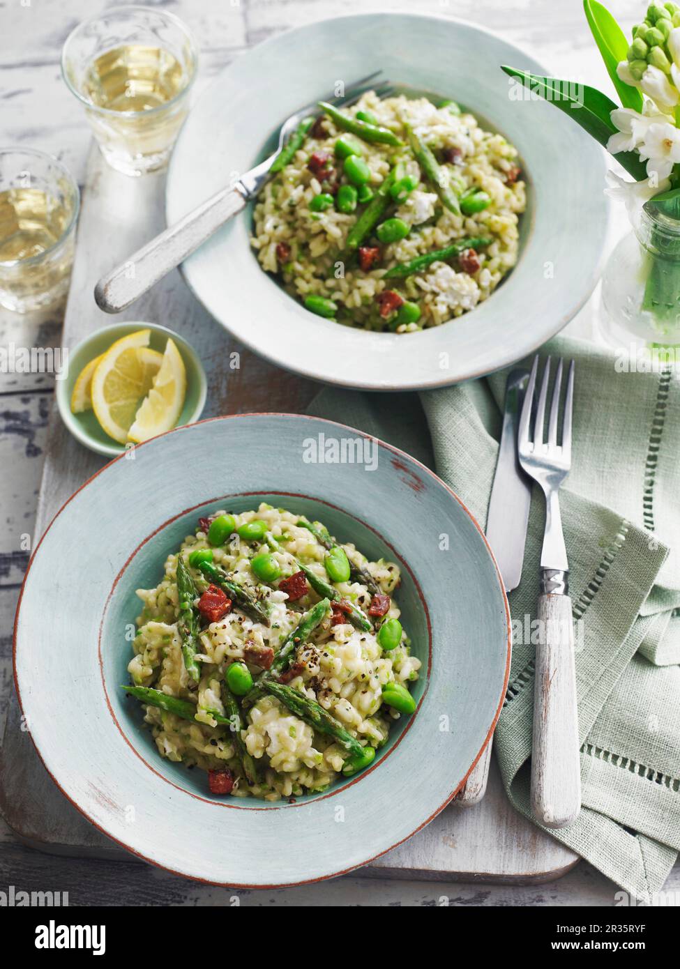 Spring risotto with green asparagus and peas Stock Photo - Alamy