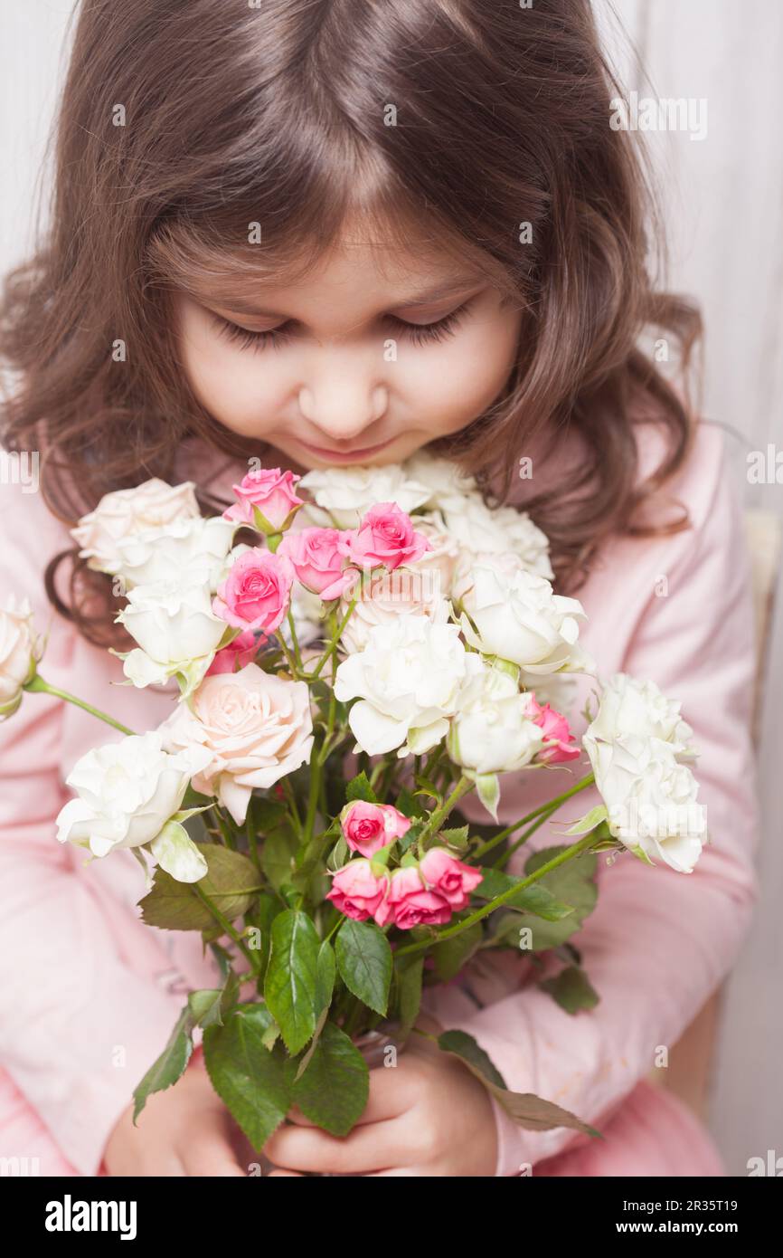 Baby girl giving flower hi-res stock photography and images - Alamy