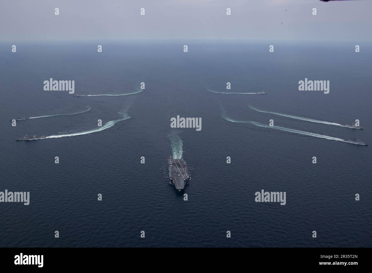 The Gerald R. Ford Carrier Strike Group sails in formation during a ...