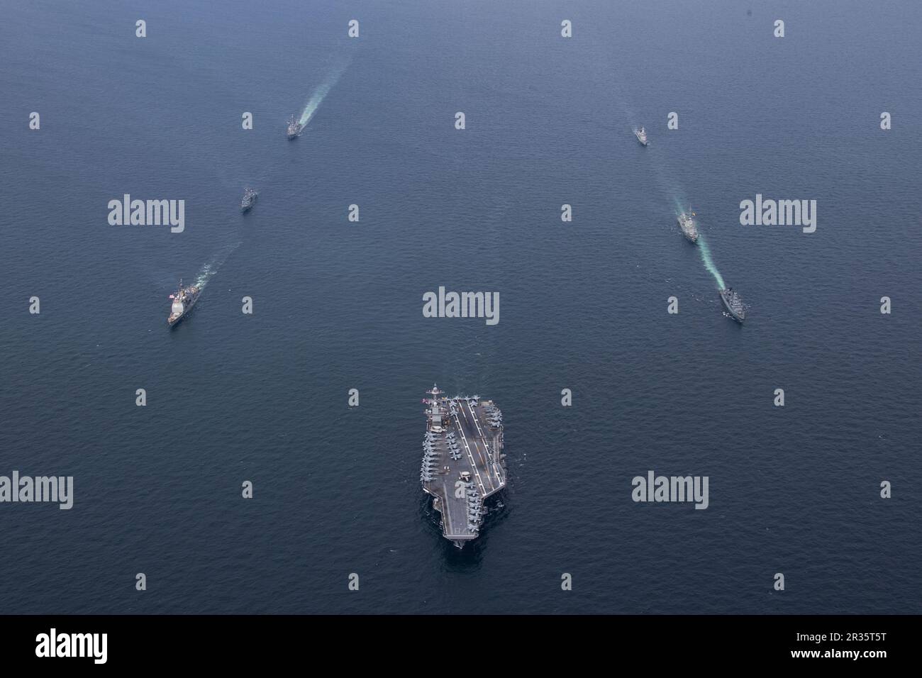 The Gerald R. Ford Carrier Strike Group sails in formation during a ...