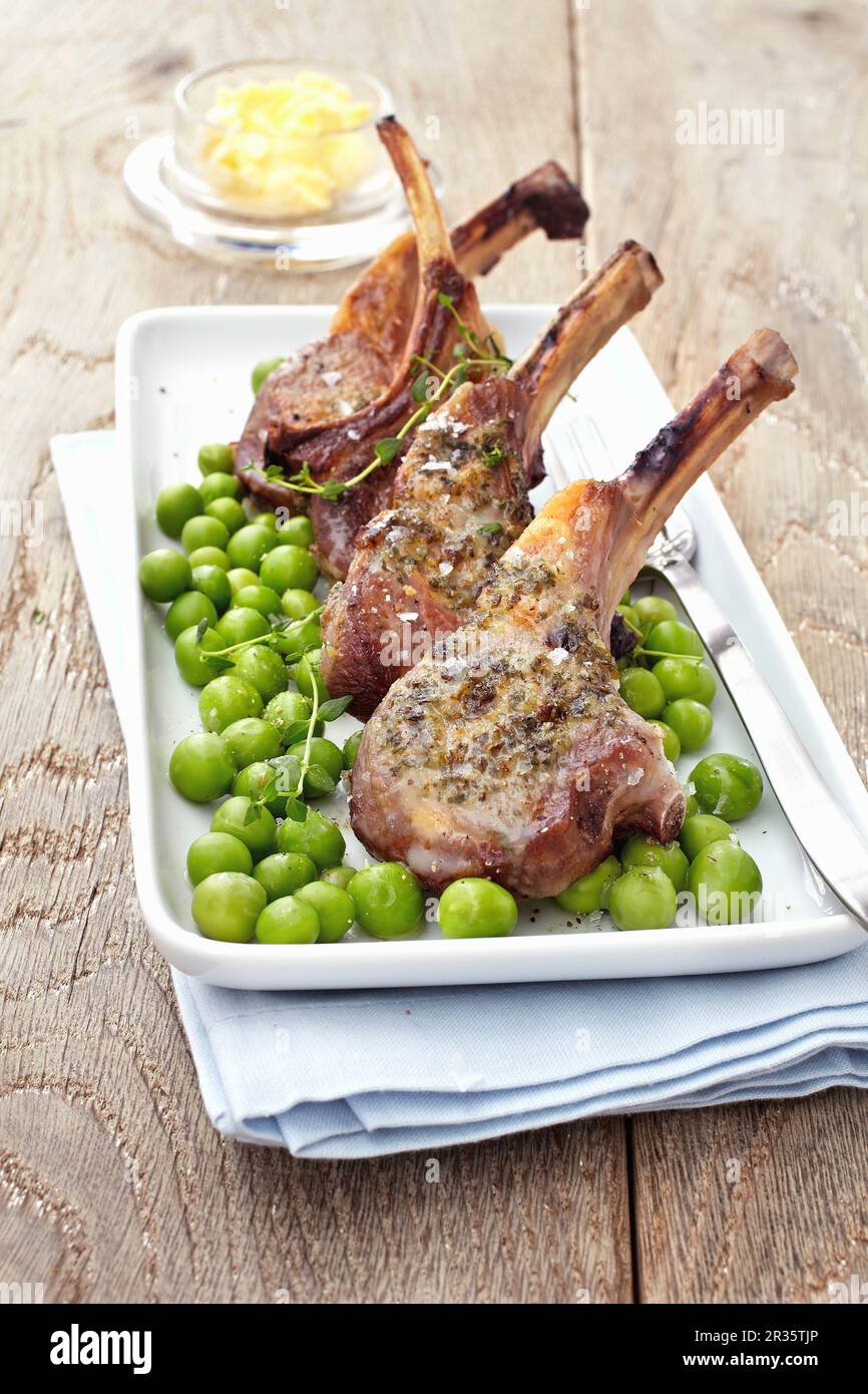 Grilled lamb chops with peas Stock Photo - Alamy