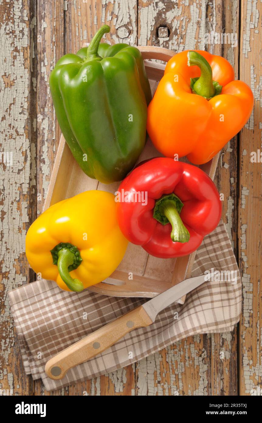 Colourful peppers on a wooden tray Stock Photo - Alamy