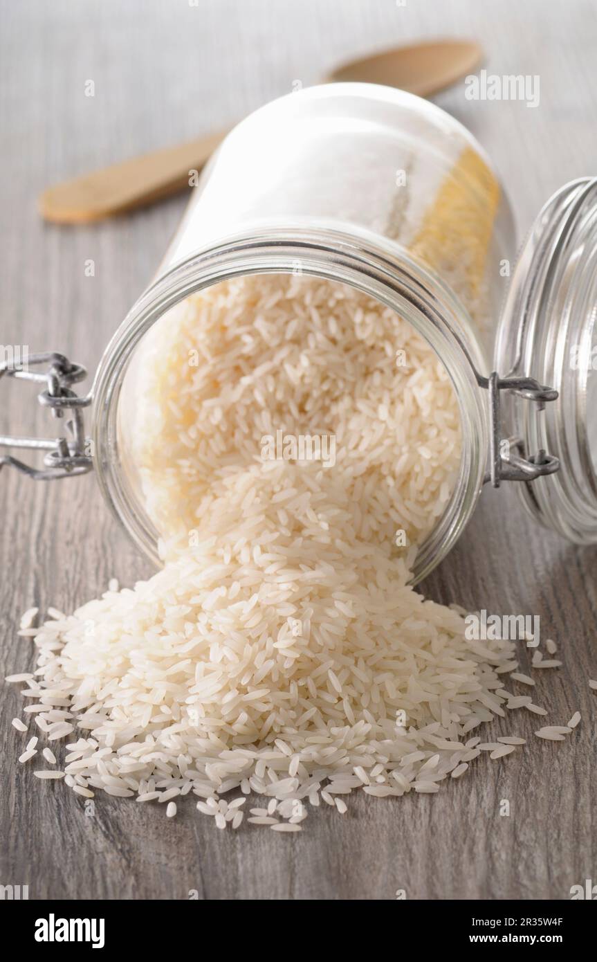 Long grain rice in an overturned jar Stock Photo - Alamy