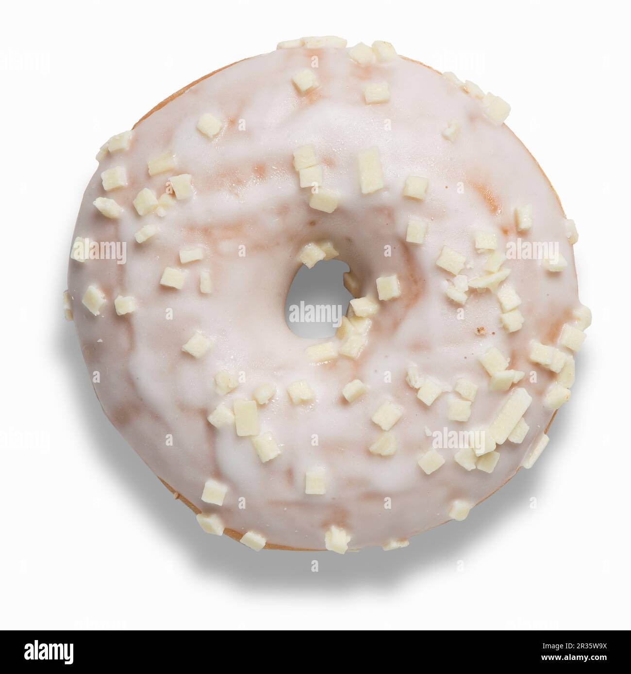 A doughnut with white chocolate glaze and white chocolate pieces Stock ...
