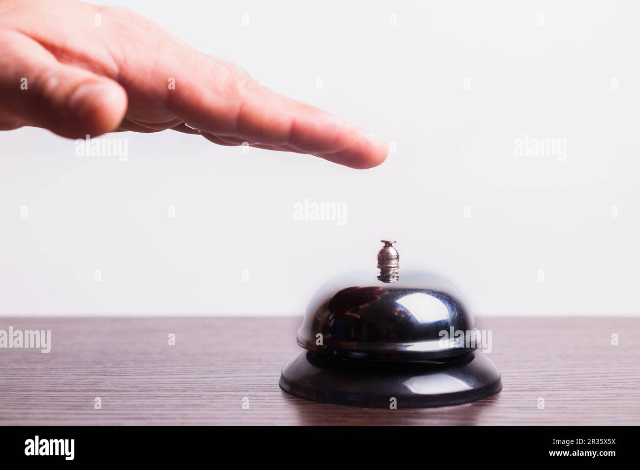 Hotel bell hand hi-res stock photography and images - Alamy