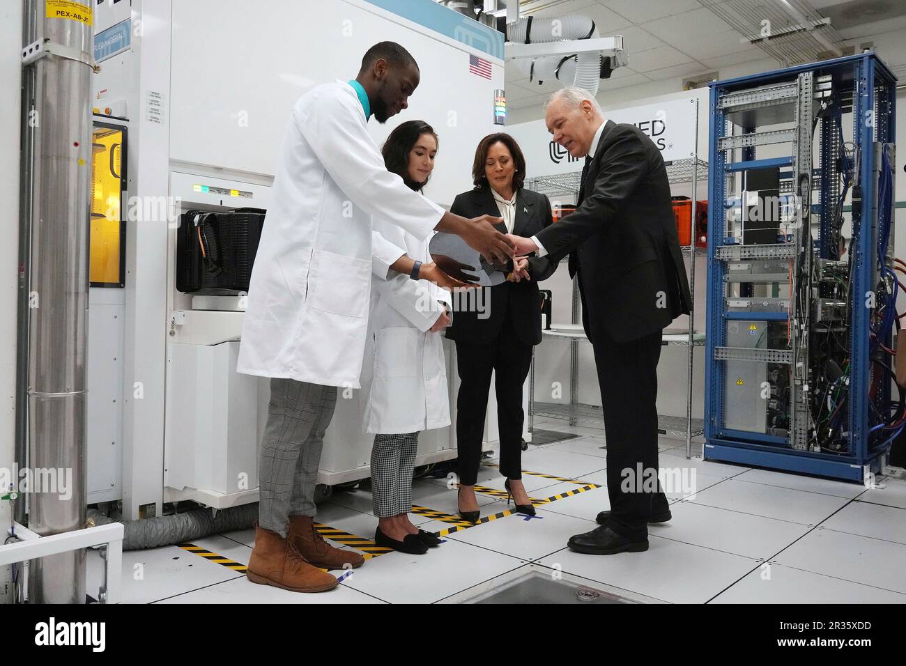 Vice President Kamala Harris, second from right, listens as Applied ...