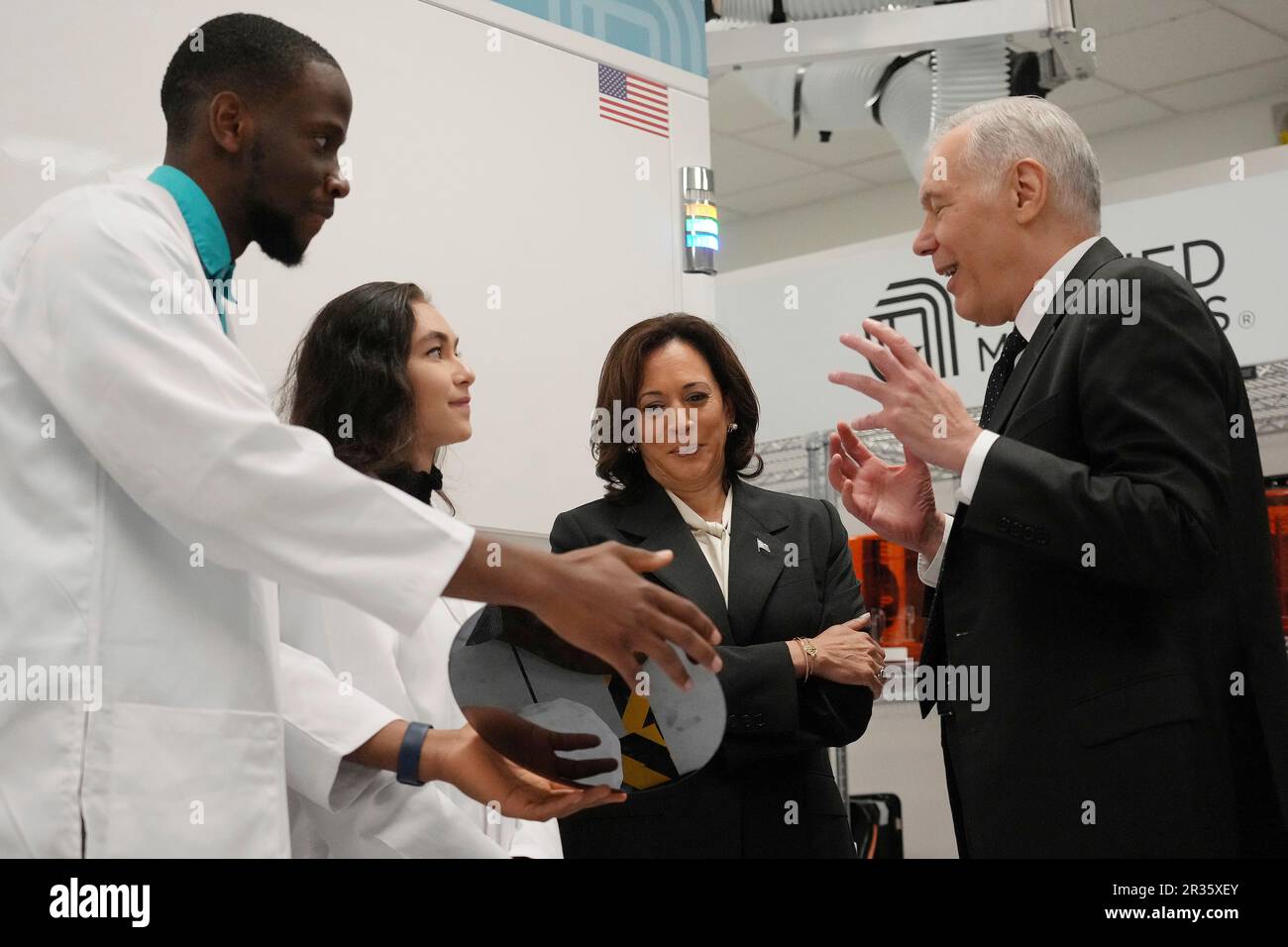 Vice President Kamala Harris, second from right, listens as Applied ...