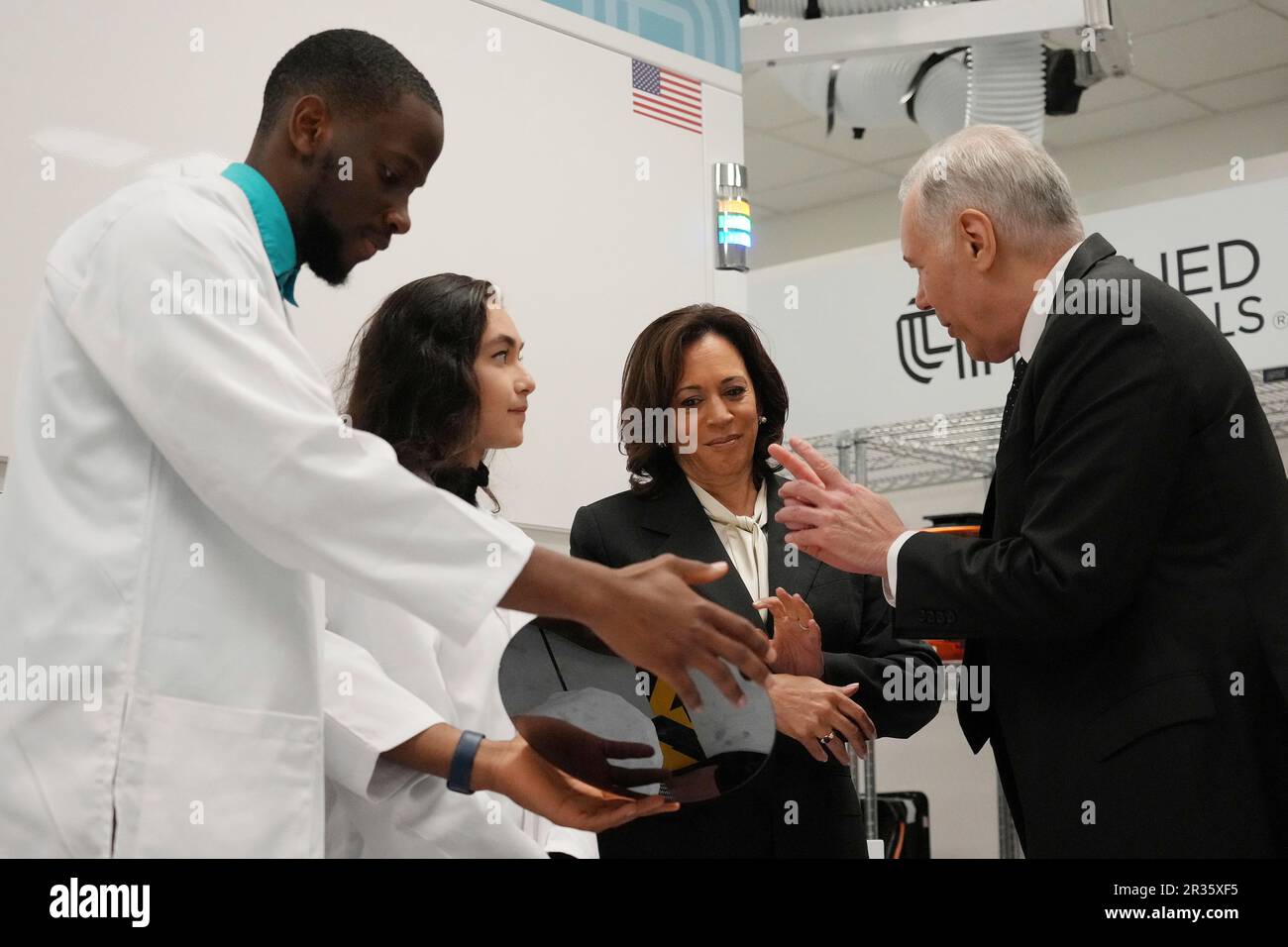 Vice President Kamala Harris, second from right, listens as Applied ...