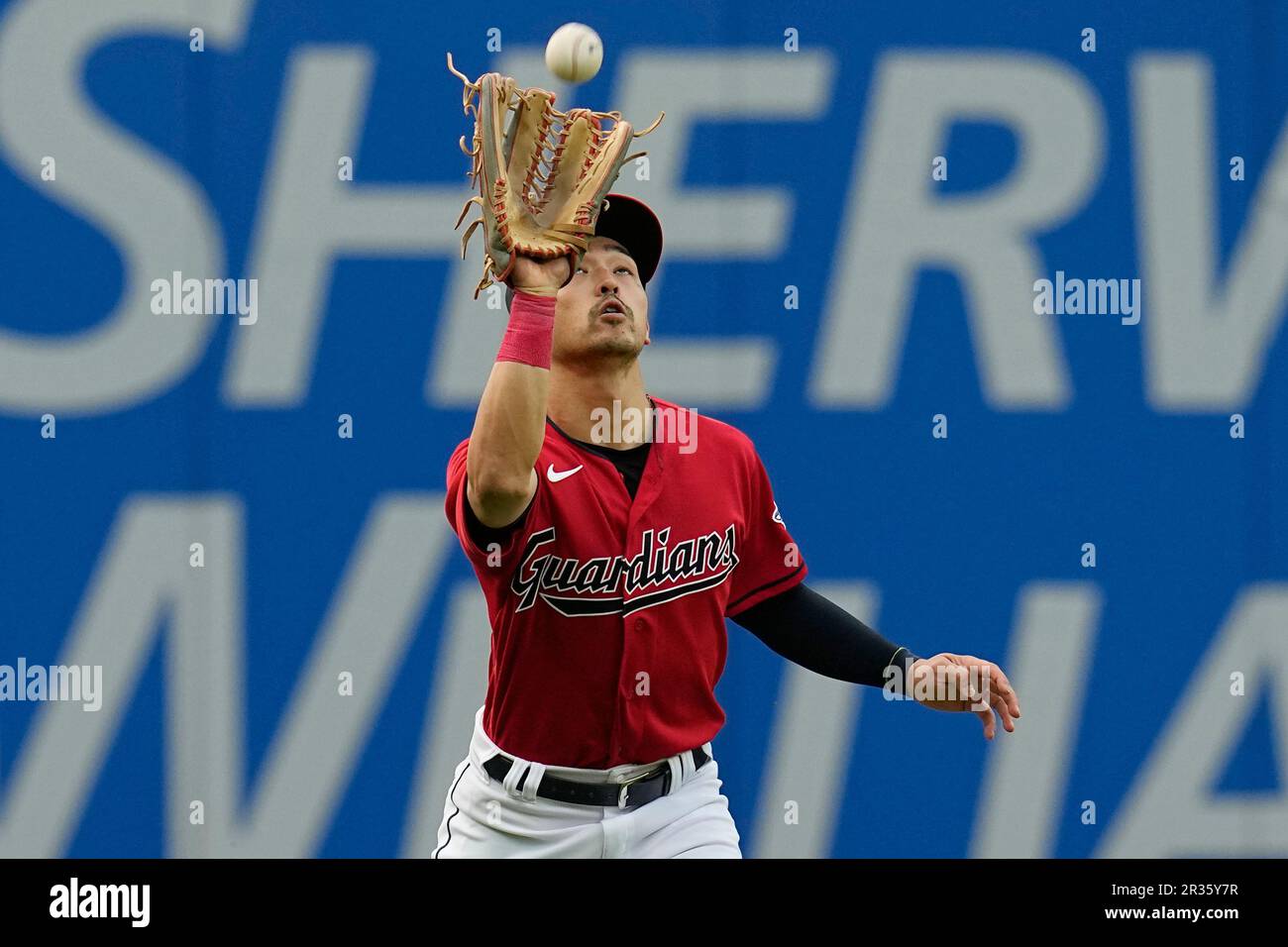 Cleveland Guardians left fielder Steven Kwan catches a fly ball hit for ...