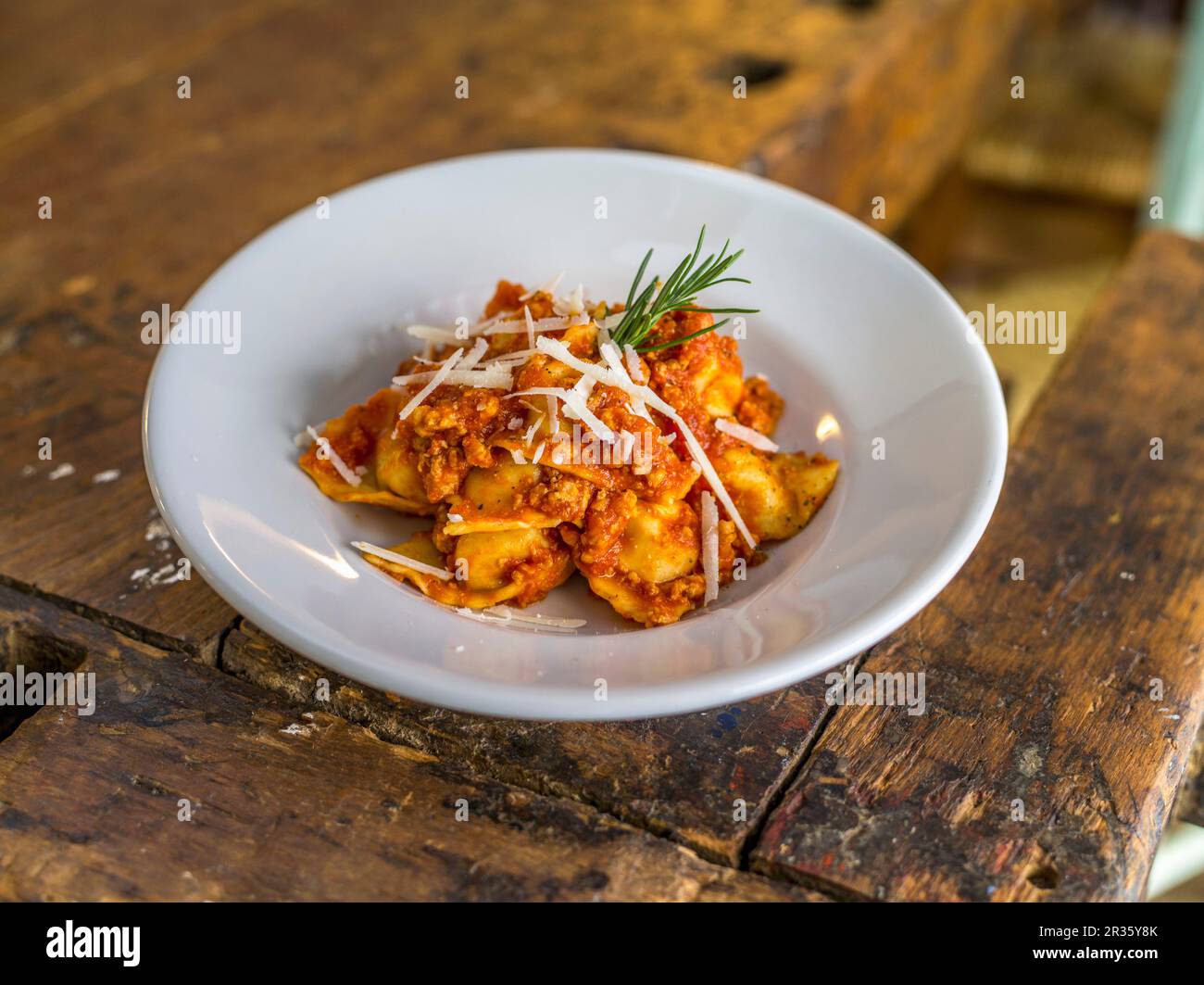 Ravioli with a minced meat sauce in a restaurant Stock Photo - Alamy
