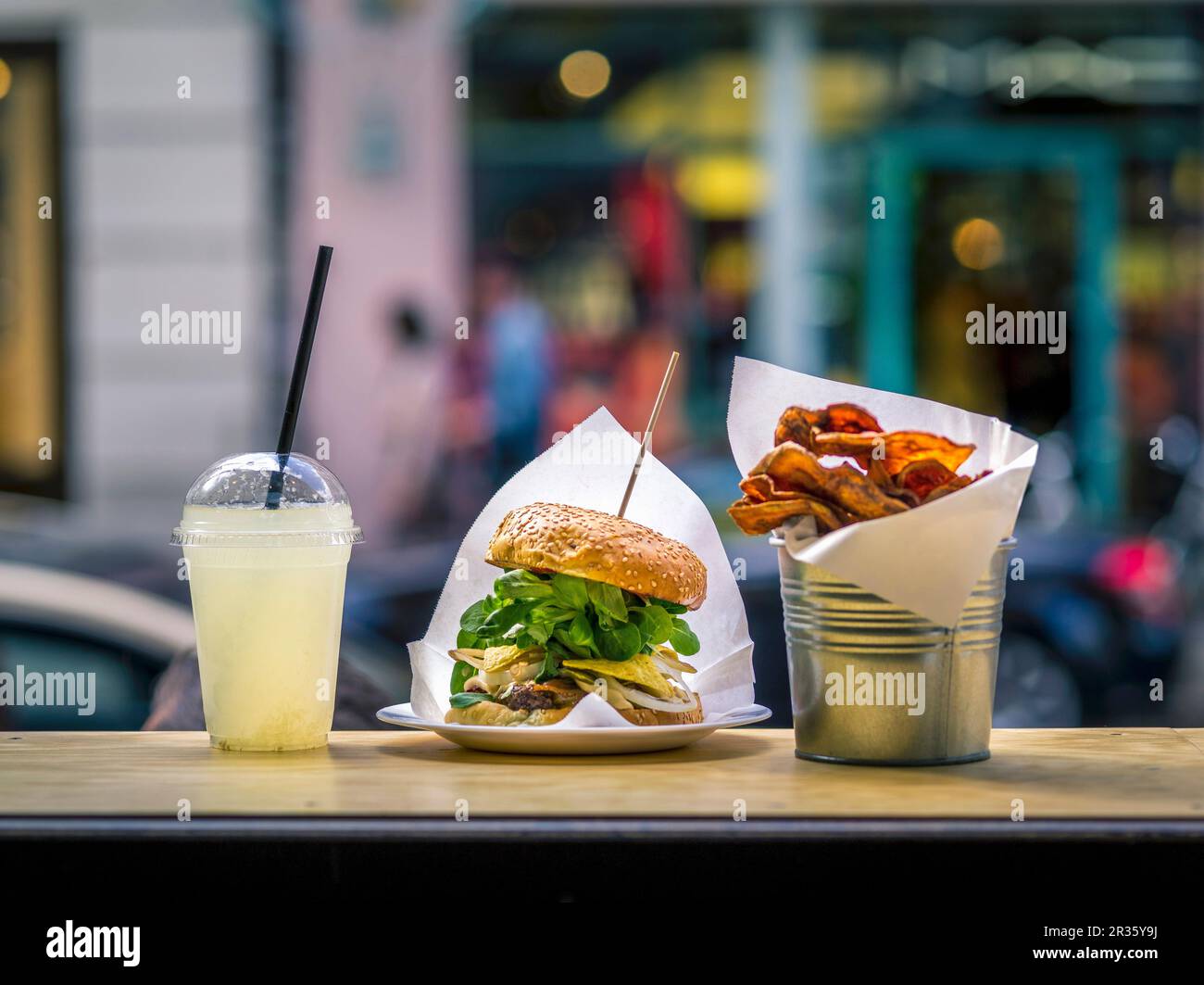 A burglar, lemonade and chips in a fast food restaurant Stock Photo - Alamy